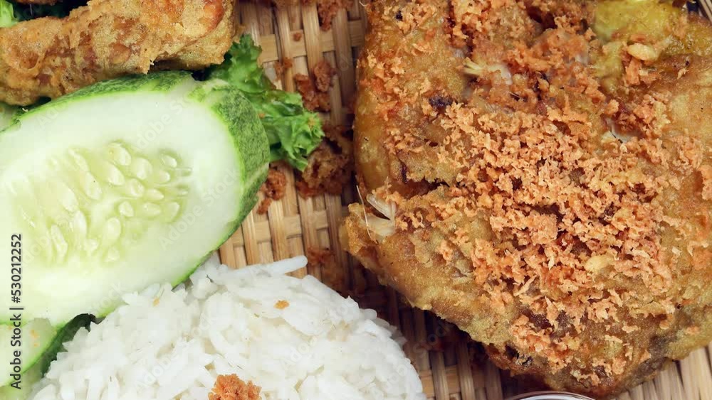 Ayam penyet a East Javanese cuisine smashed fried chicken dish with ...