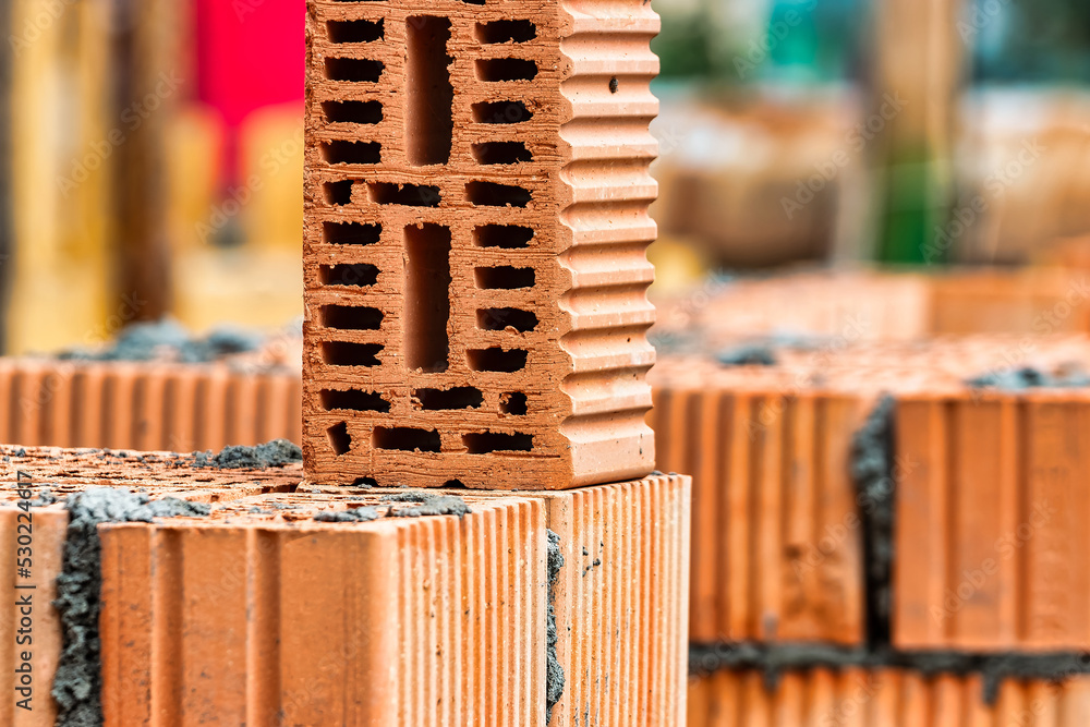 Red ceramic bricks at the construction site. Keramoblock. Hollow brick ...