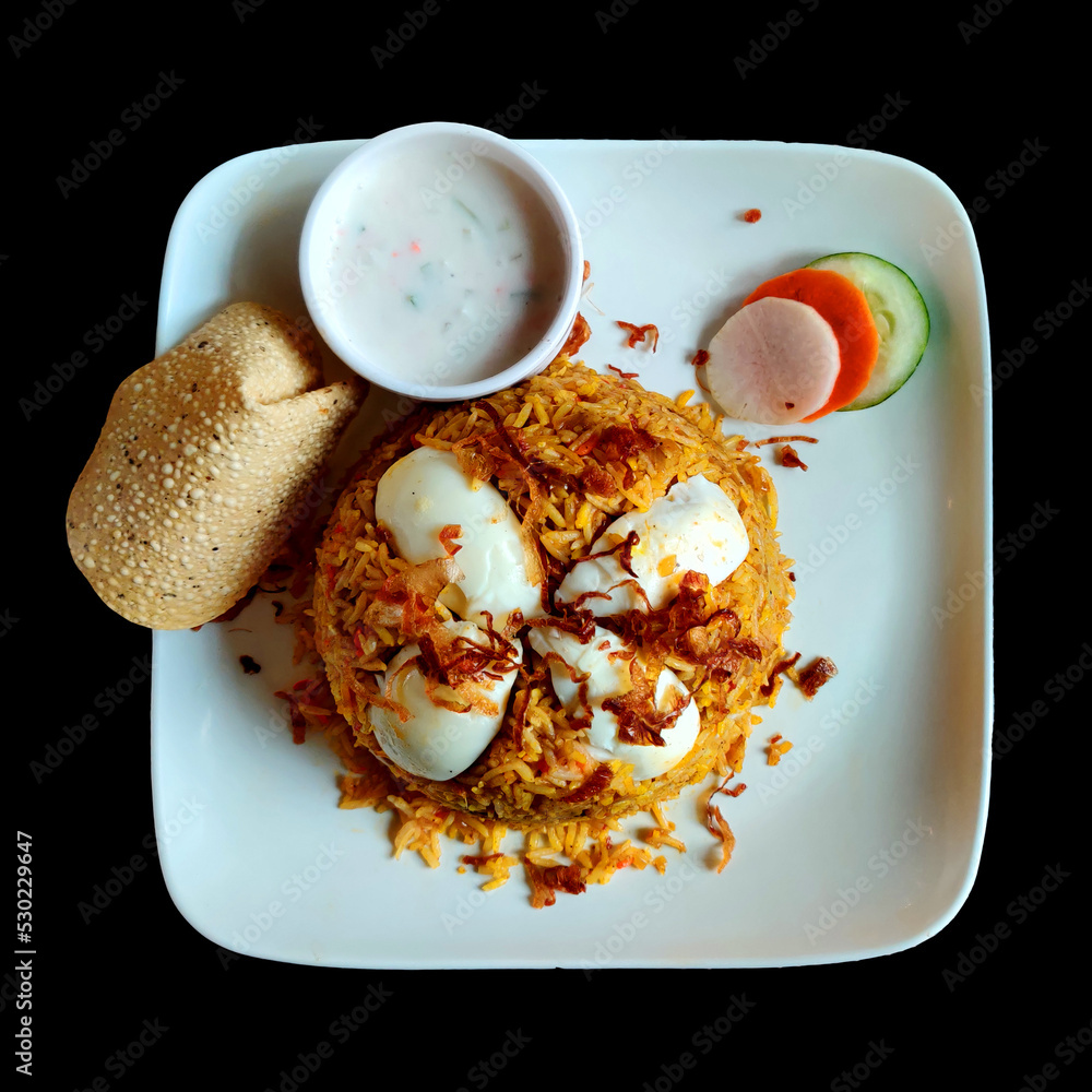 Chicken biryani served in a plate. Chicken biryani with boiled eggs ...