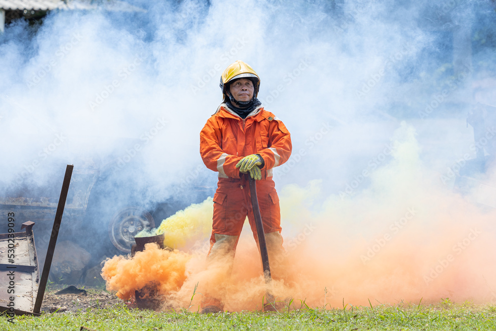 Firefighters wearing helmets with fire safety equipment Use Twirl ...