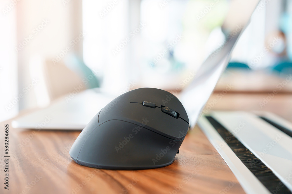 ergonomic mouse on desk at workplace, prevention wrist pain because ...