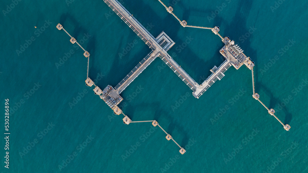 Aerial top view oil terminal station platform with loading arm pipe ...