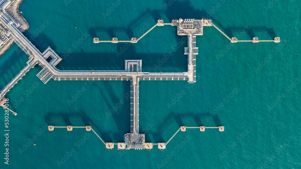 Aerial top view oil terminal station platform with loading arm pipe ...