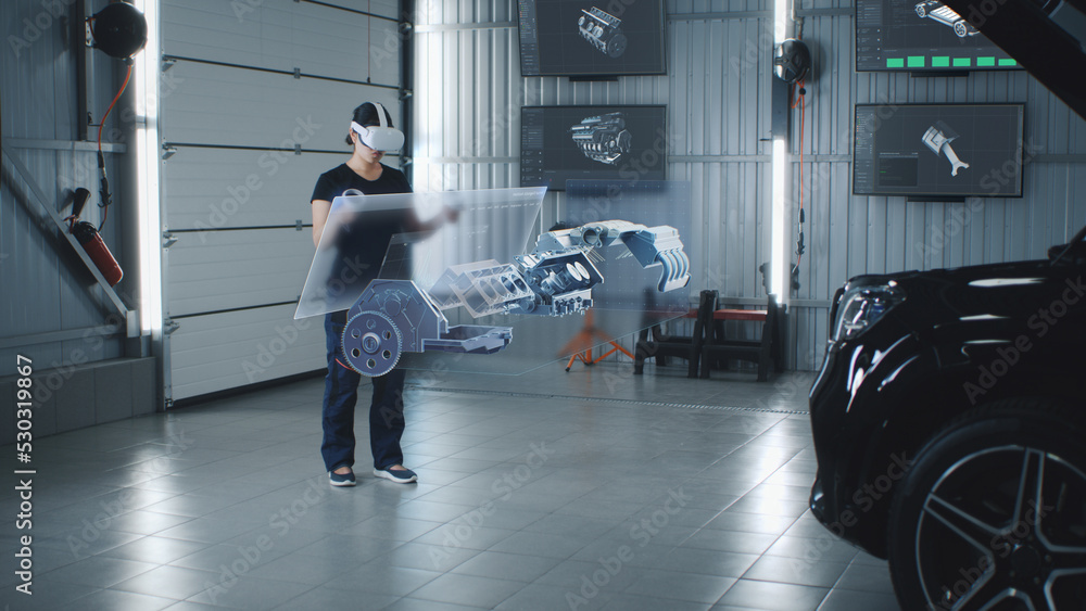 An automotive maintenance engineer conducts a review of an internal ...