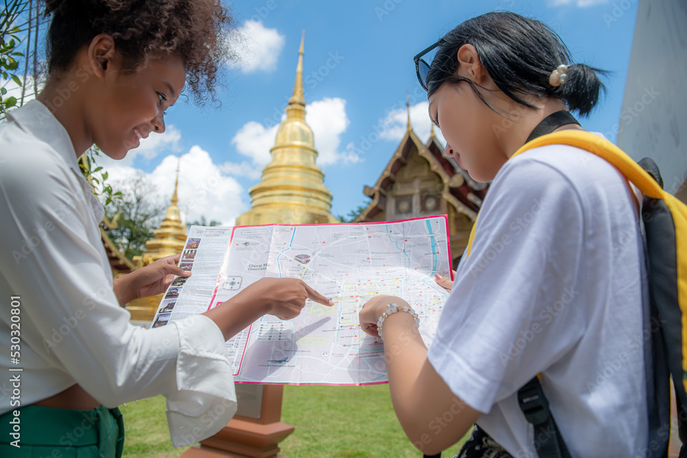 Female tourist looking at the beautiful view of Wat Phra Singh One of ...