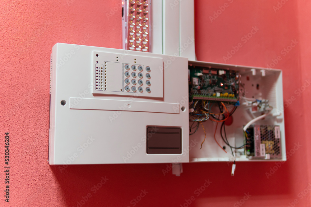 Fire alarm control panel is activated and in alert mode. Selective ...