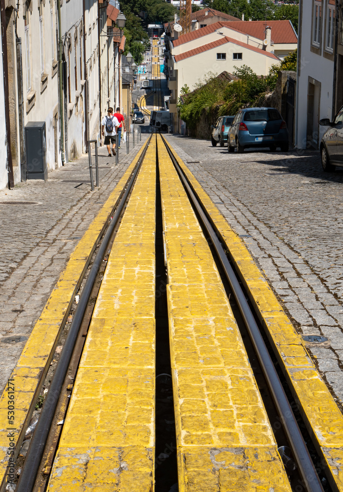 Tram track and tram car parked at the base from the point of view of ...