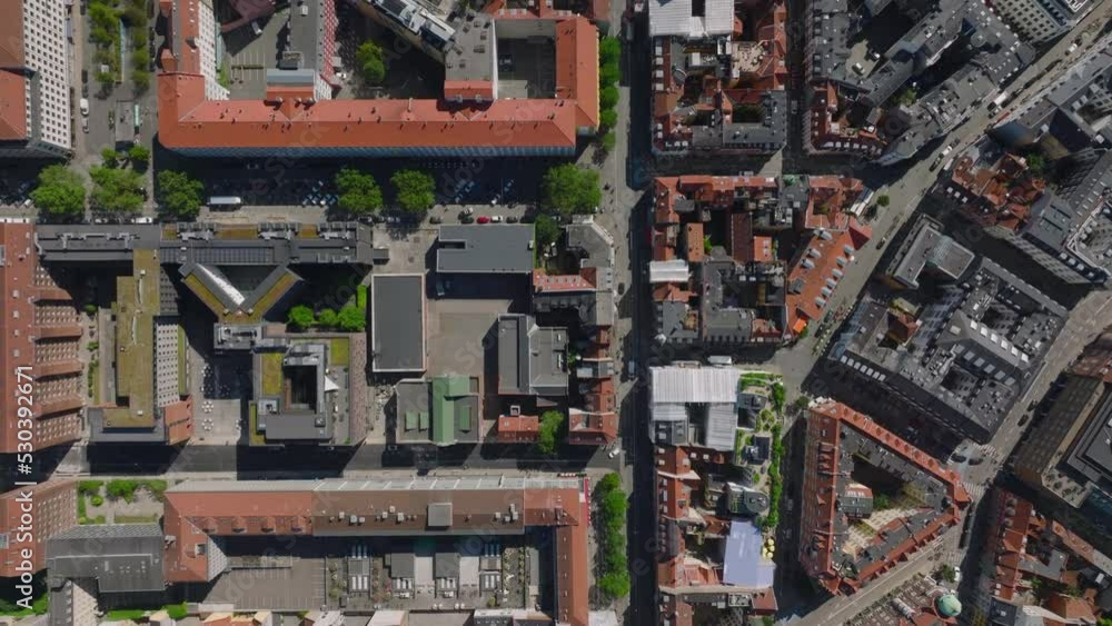 Top down panning view of town developments in city. Fly above blocks of ...