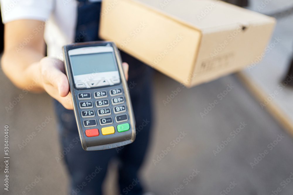 Payment NFC employee in the courier company delivery of the order in ...