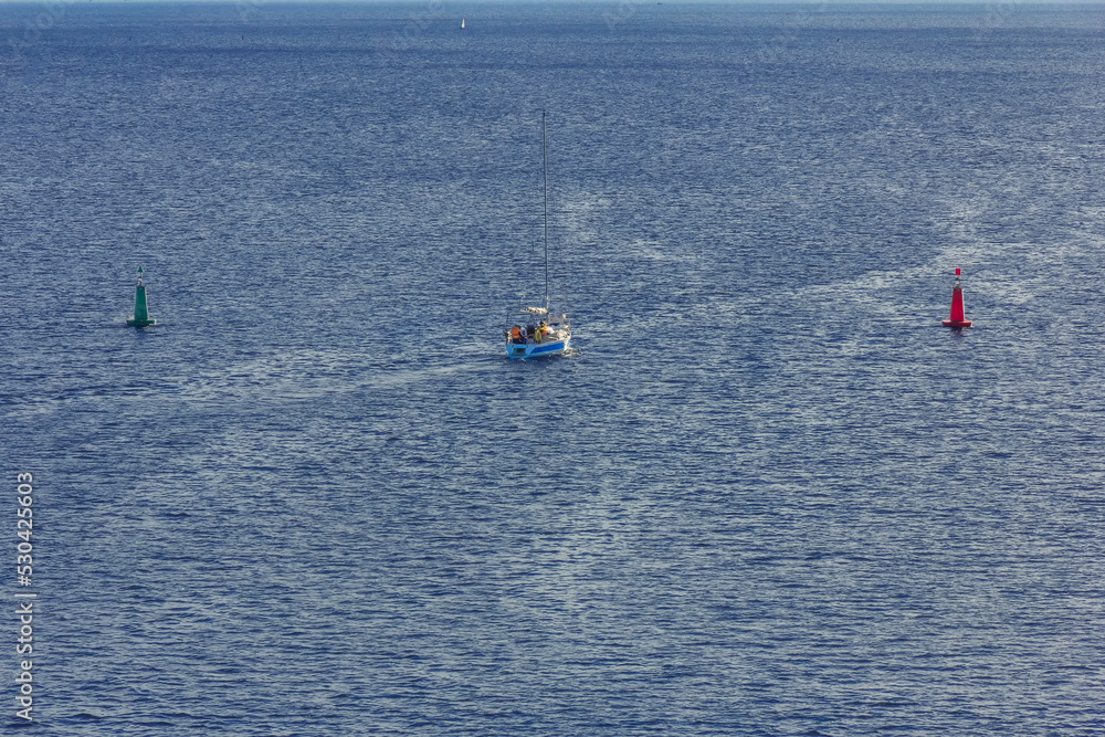 Red and green navigational buoys, starboard and port side buoys on open ...