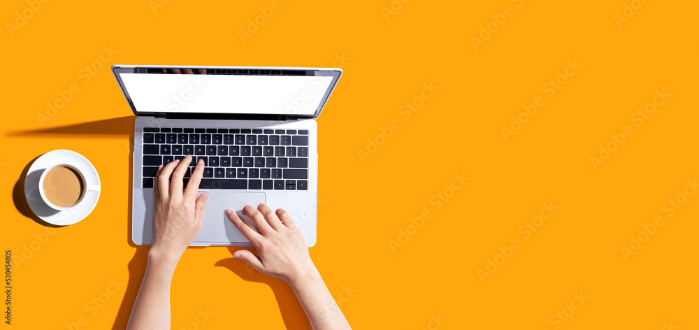 Person using a laptop computer from above Stock Photo | Adobe Stock
