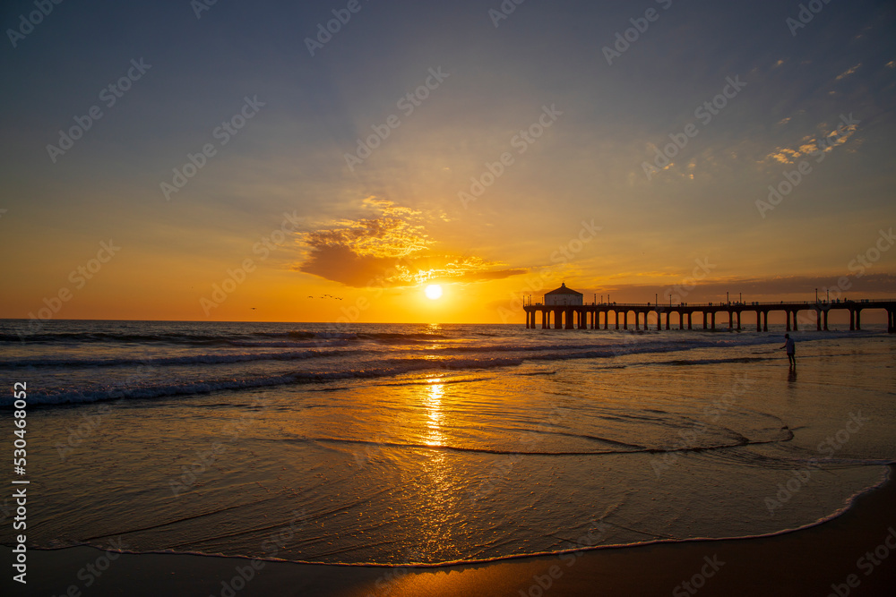 a gorgeous summer landscape at the Manhattan Beach Pier with a stunning ...