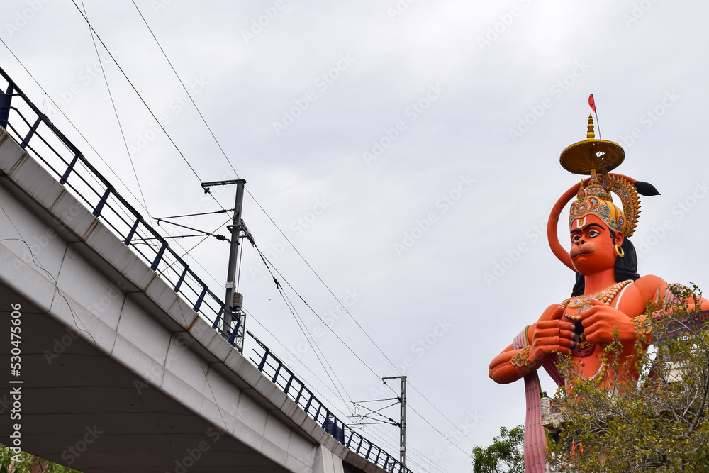 Big statue of Lord Hanuman near the delhi metro bridge situated near ...