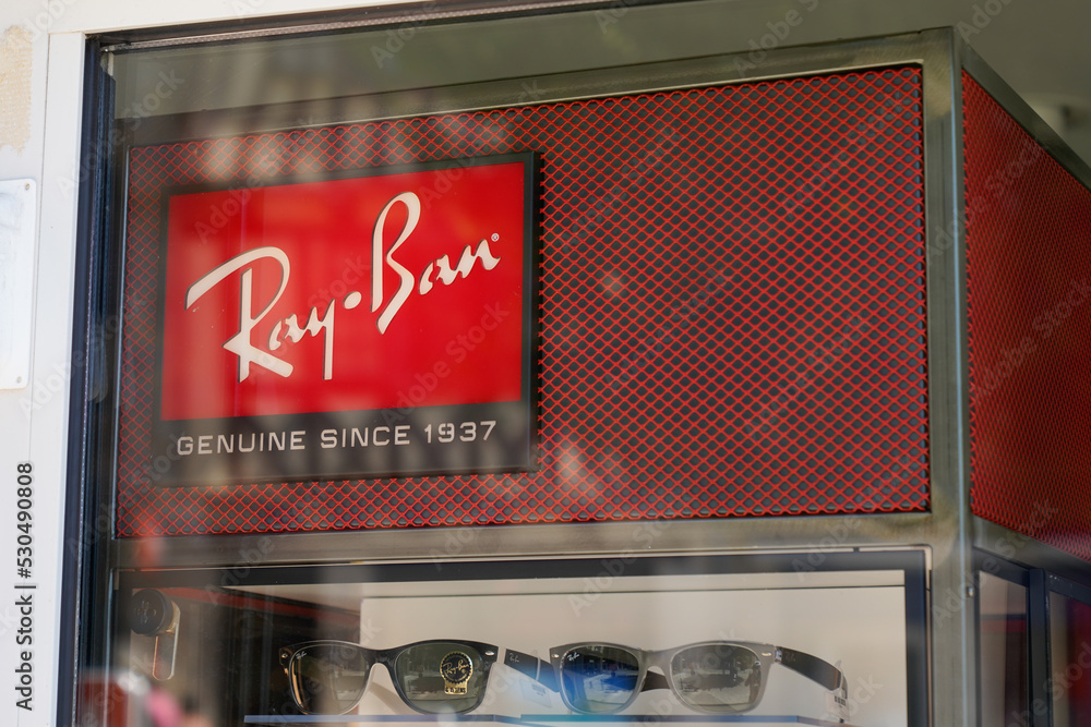 Ray ban sign brand and text logo facade store of sunglasses branding in ...