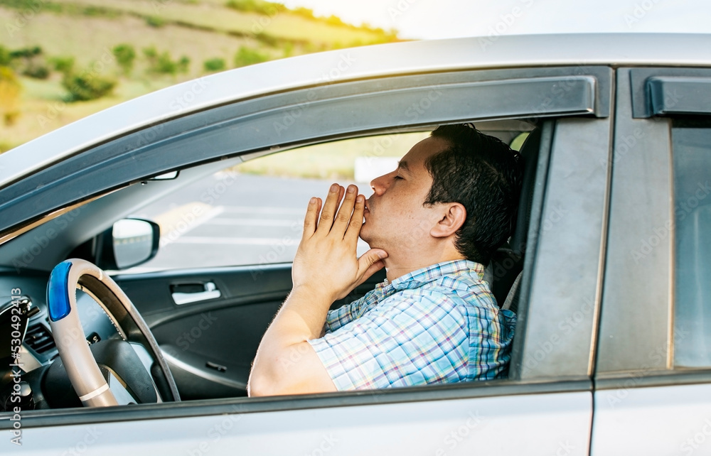 Close up of driver praying in his vehicle, Driver male praying in his ...