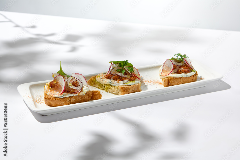 Aesthetic composition with tomato bruschetta on white background with ...