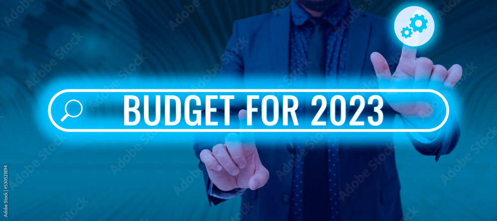Sign displaying Budget For 2023An written estimates of income and ...