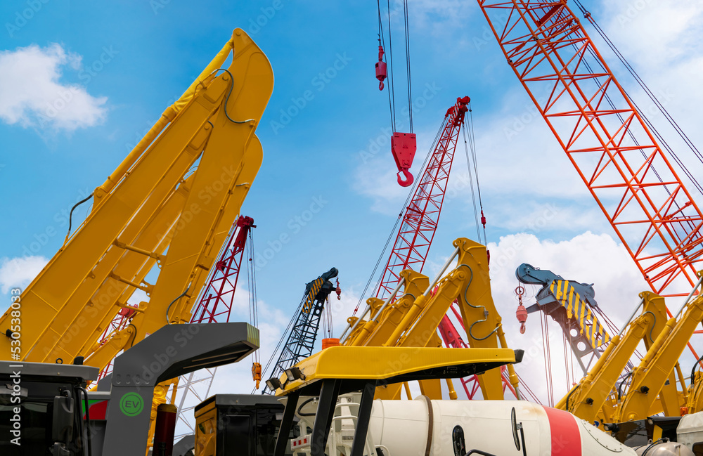 Crawler crane against blue sky. Real estate industry. Red crawler crane ...