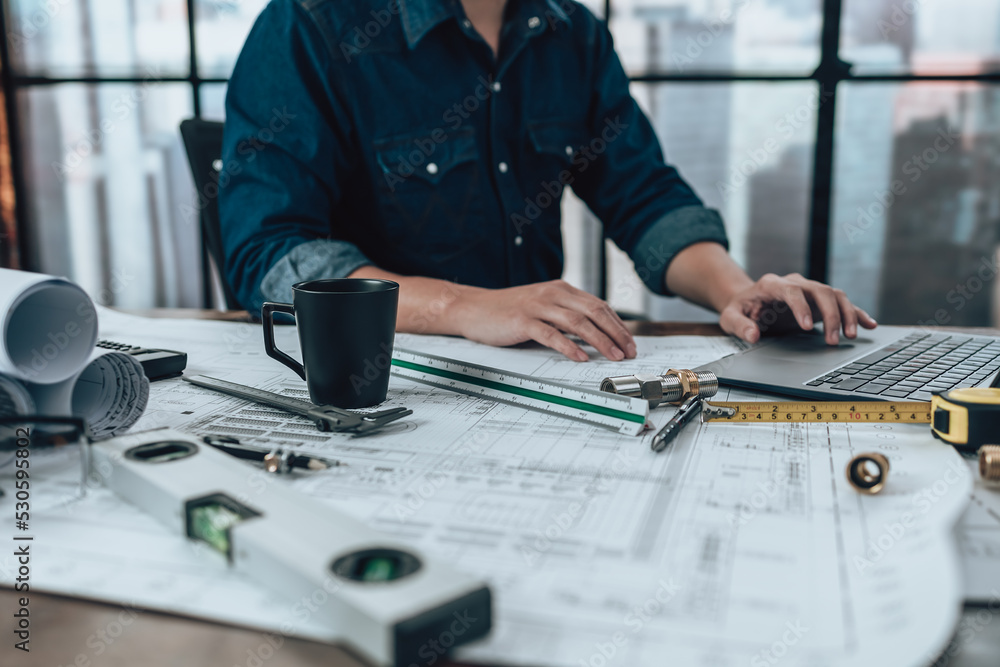 Joint pipe with drawings on the office desk and Calculator, triangle ...