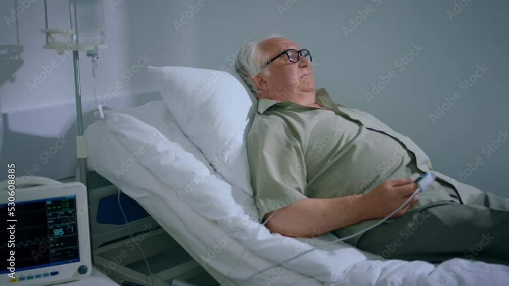 In the hospital the patient old man patient resting in bed eating for a ...