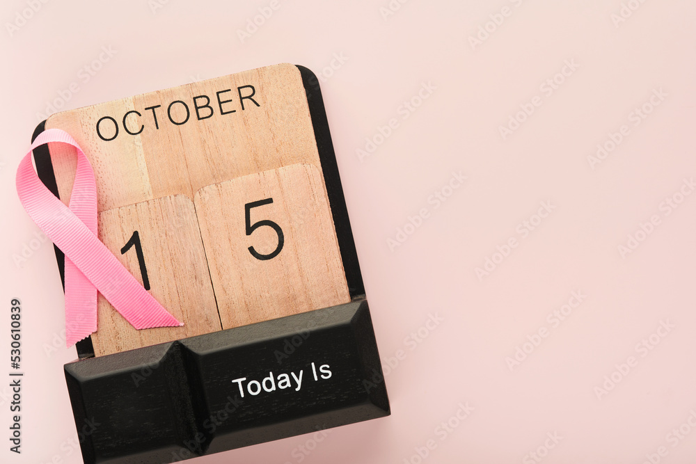 Pink Breast Cancer Awareness Ribbon. Wooden calendar with pink ribbons ...