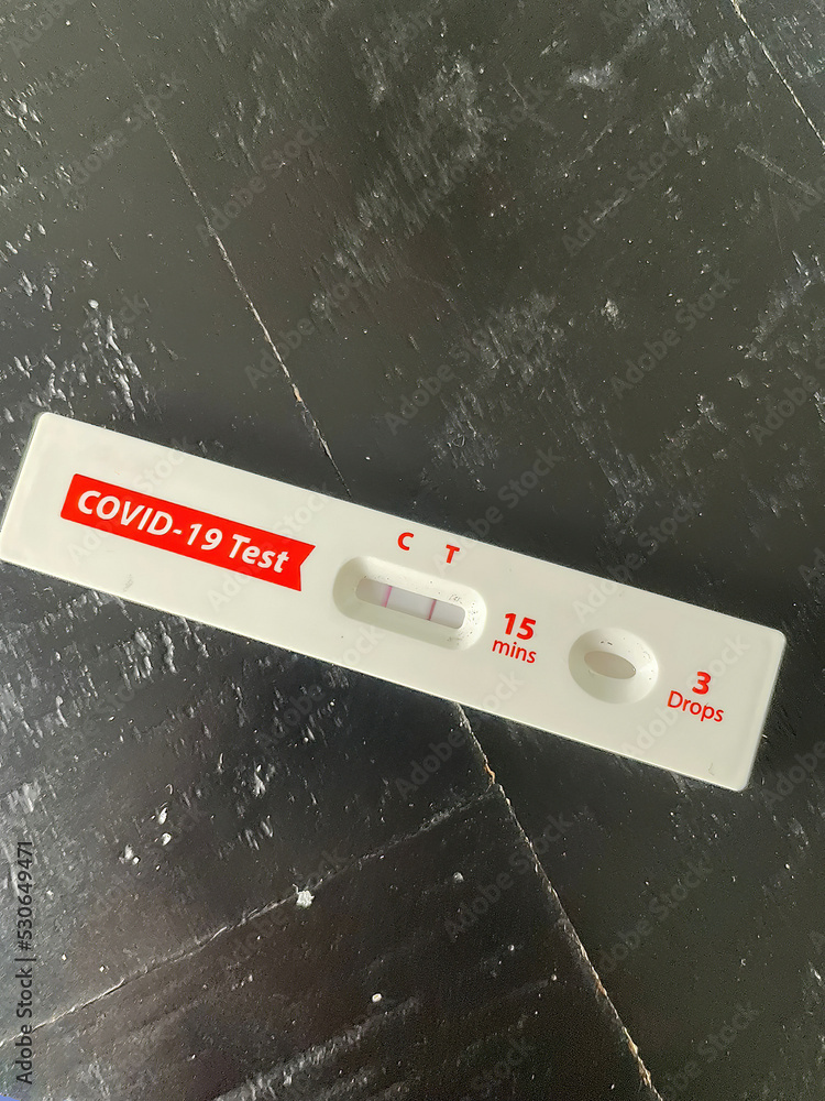 positive covid self test vertical image Stock Photo | Adobe Stock