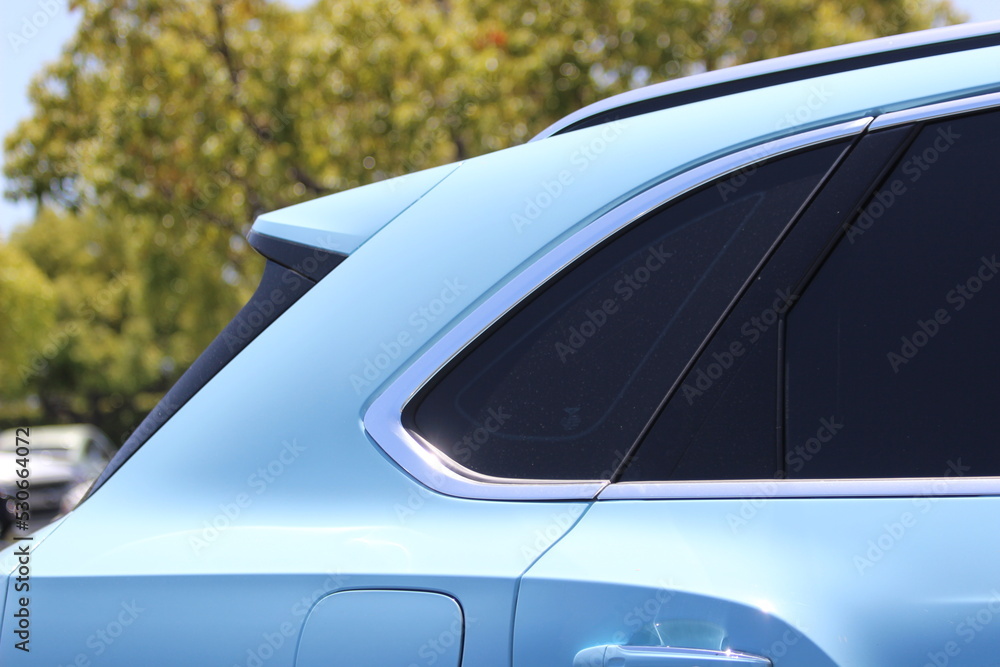 Sleek blue SUV hybrid sports car, meticulously designed with a focus on ...