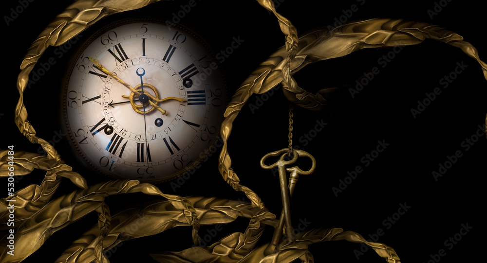 An old antique clock with roman numerals on the dial in carved golden ...