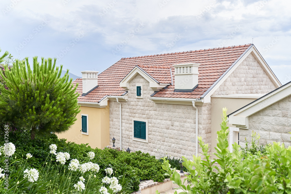 House with modern polymer roofing shingles Stock Photo | Adobe Stock