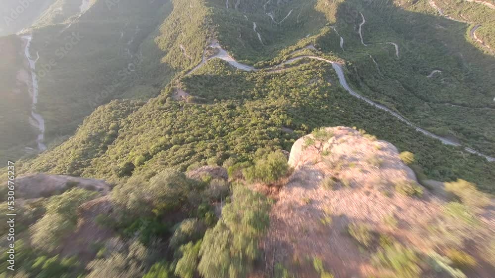 Fast extreme close dive, drop down, steep rocky mountains, cliff top ...