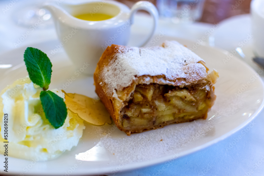 Austrian sweet dessert, portion of apple strudel with whippen cream and ...