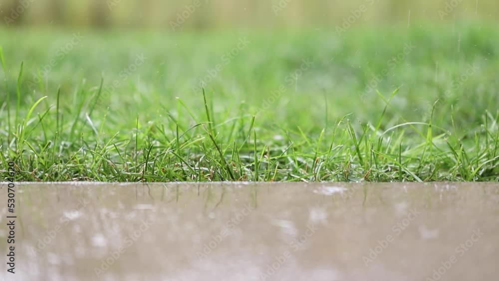Vidéo Stock Slow motion of rain drops falling on concrete surface in ...