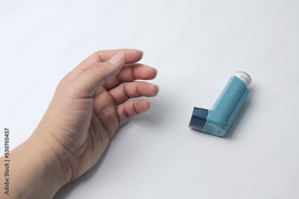 Bangkok, Thailand - September 2022 : Man's hand picking up asthma ...
