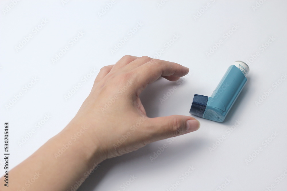 Bangkok, Thailand - September 2022 : Man's hand picking up asthma ...