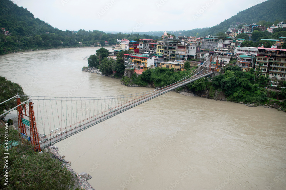 Lakshman Jhula a suspension bridge across the river Ganges. Bridge ...