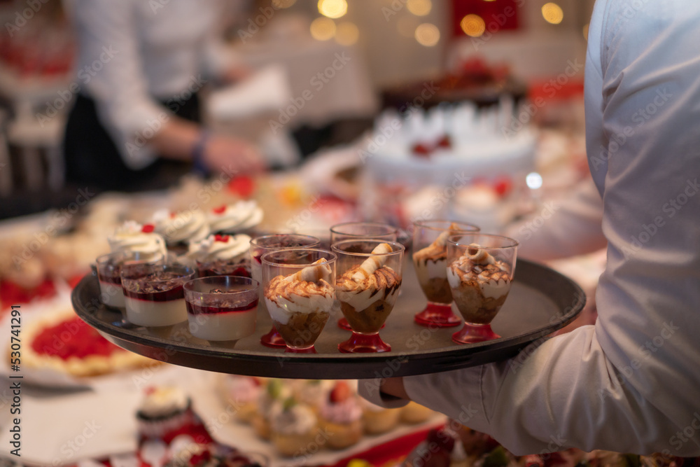 waiters serving desserts Stock Photo | Adobe Stock