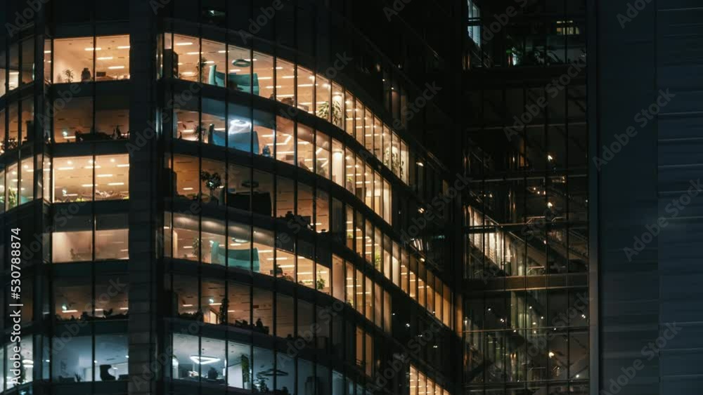 Time lapse blinking office windows lights in business center building ...