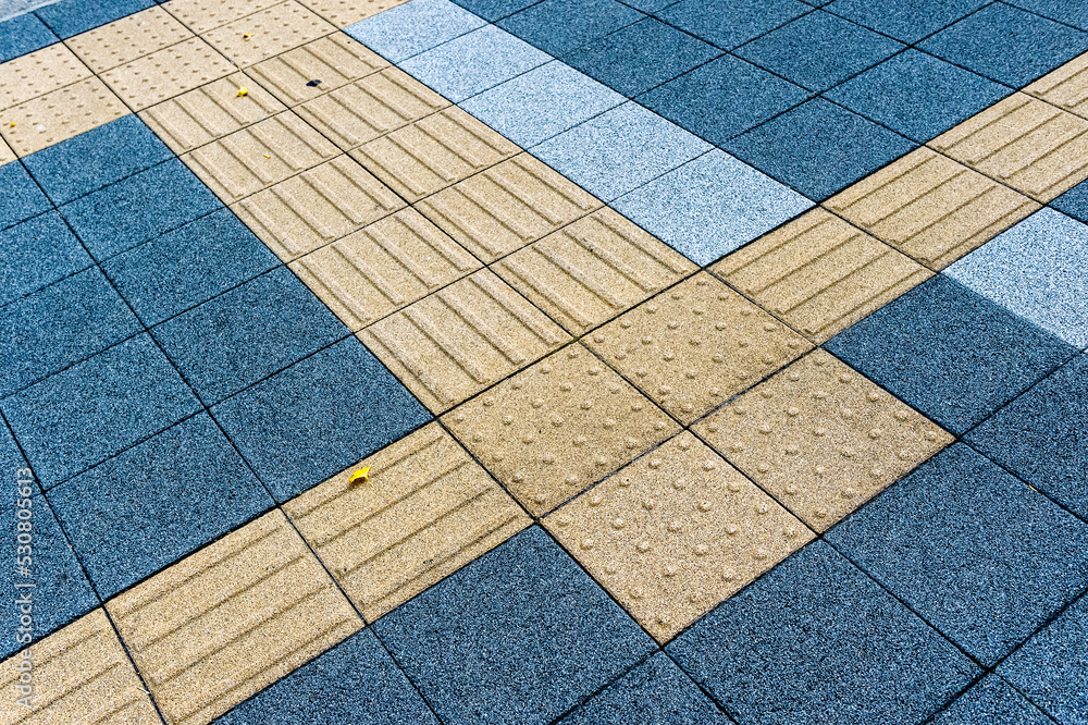 Tactile tiles at the crossing of the road in Tokyo city in Japan Stock ...
