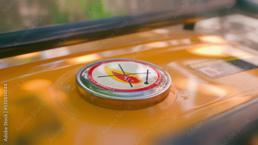 Filler cap of an orange gas tank close-up. Flammable hazardous material ...