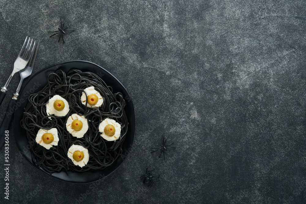 Halloween party Italian black pasta decorated horror olives like eyes ...