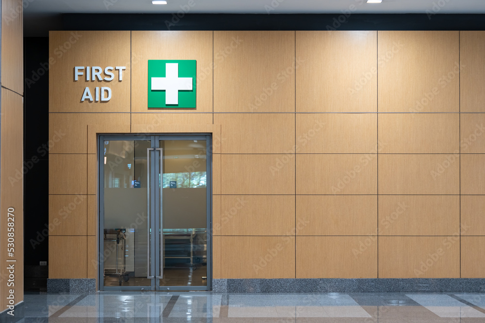 First Aid room inside a building. Decorated with pain light brown wall ...
