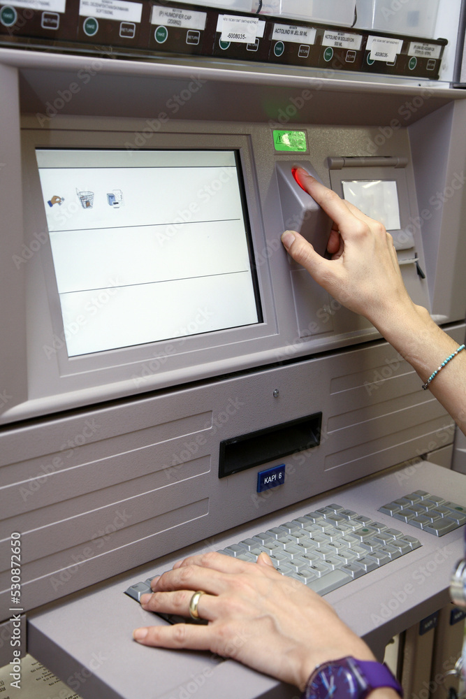 pharmacist selects medicine from hospital medicine automation system by ...