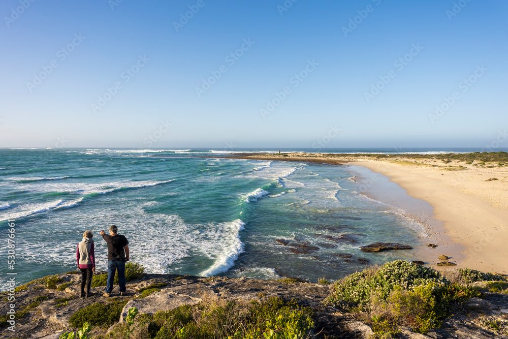 Tourists looking towards Struis Point (Struispunt) and Saxon Reef from ...