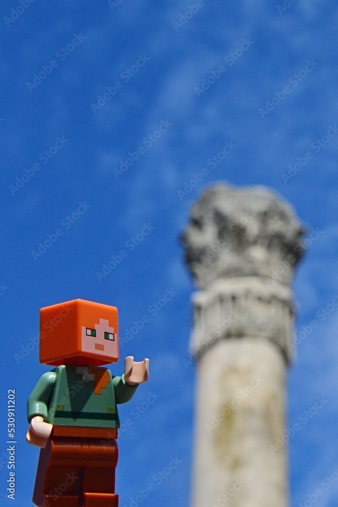 LEGO Minecraft figure of Alex with raised hand standing in front of ...