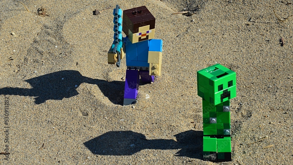 LEGO Minecraft figure of Steve with diamond sword chasing hostile ...