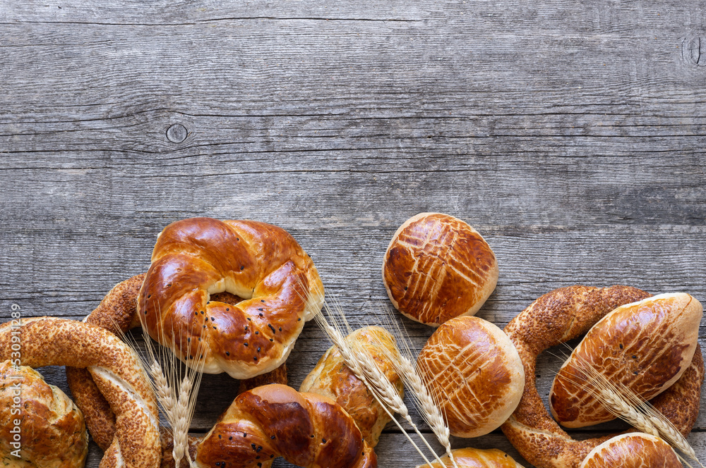 Traditional Turkish pastry concept, pogaca , bagel, on rustic table ...