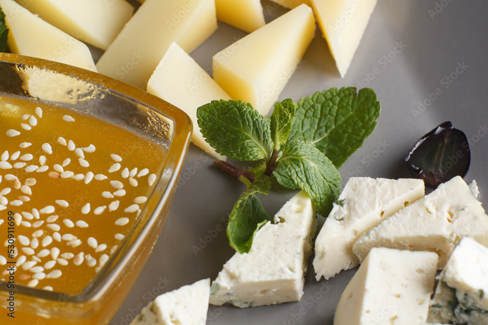 four types of cheese, feta, gorgonzola, parmesan, hard cheese, with ...