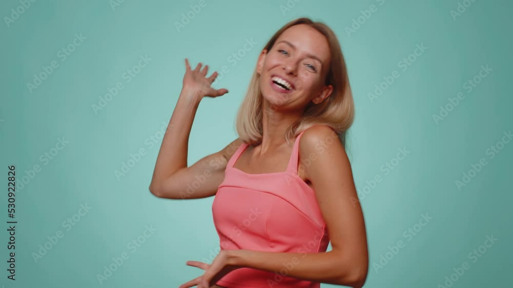 Come here, join us. Welcome. Lovely blonde woman showing inviting ...