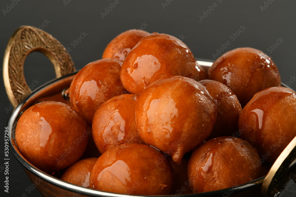 luqaimat or lokma. Freshly fried Lokma (luqma - arabic) piled high a ...