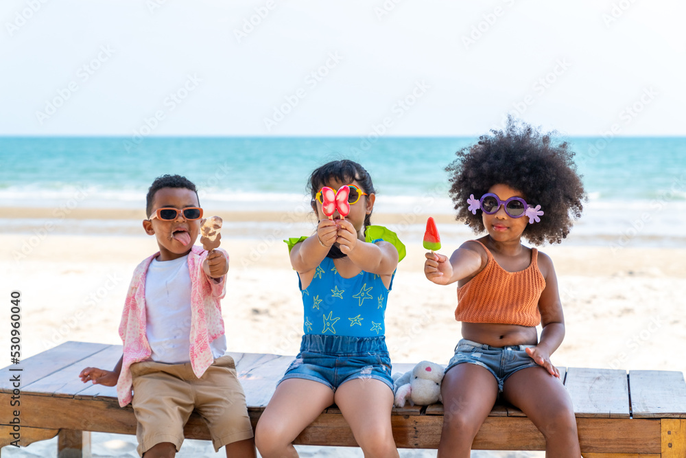 Kids Eating Ice Cream On Beach